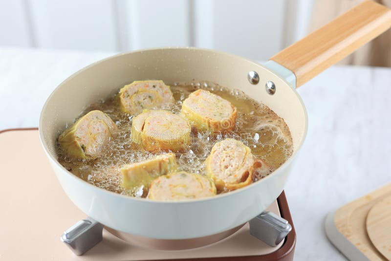 Frying Chicken Egg Roll in Hot Oil Using White Pan Stock Photo - Image ...