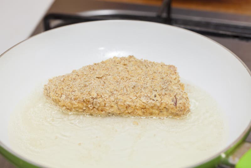 Frying a cordon bleu stock image. Image of cheese, cook - 74389723