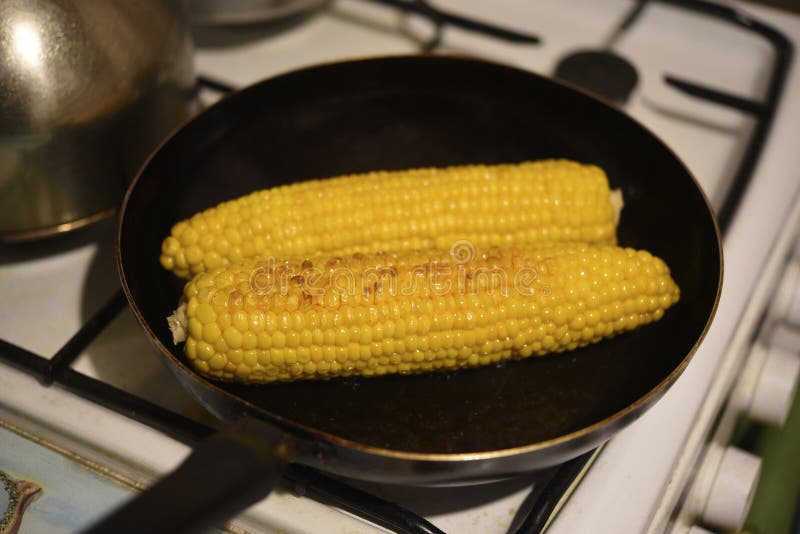 Frying Corn in a Frying Pan. a Delicacy Made of Corn Stock Image ...