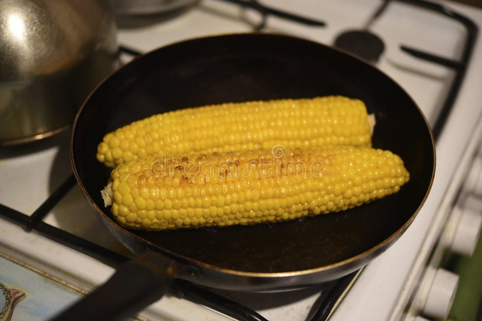 Frying Corn in a Frying Pan. a Delicacy Made of Corn Stock Image ...