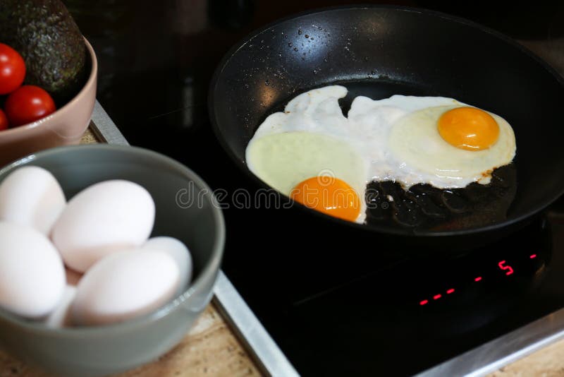 Frying Eggs in Kitchen for Tasty Breakfast Stock Image - Image of eggs ...