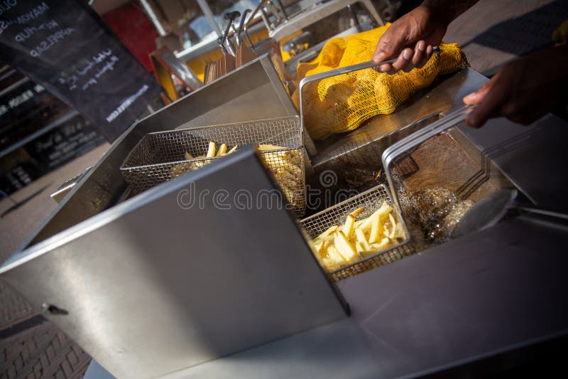 Frying fresh cut fries stock photo. Image of dutch, crispy - 272906726