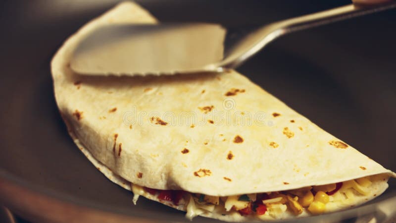 Contour Effect of Frying a Freshly Wraped Chicken Quesadilla on a ...