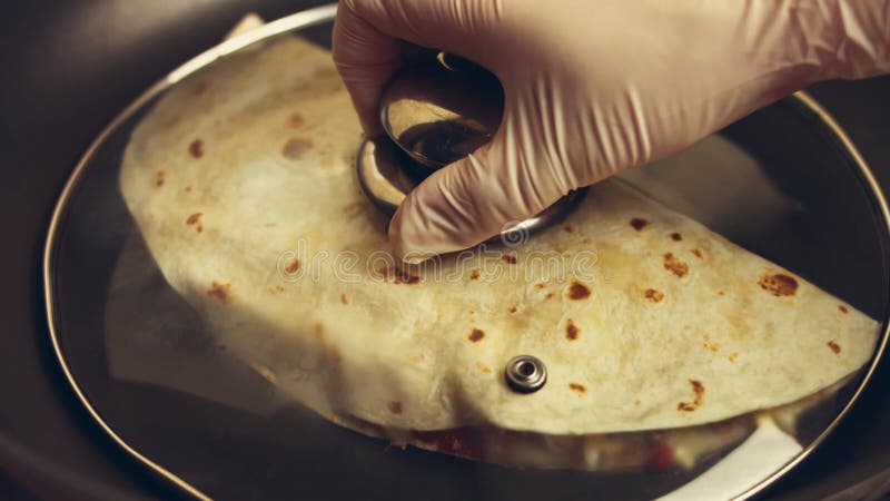 Contour Effect of Frying a Freshly Wraped Chicken Quesadilla on a ...