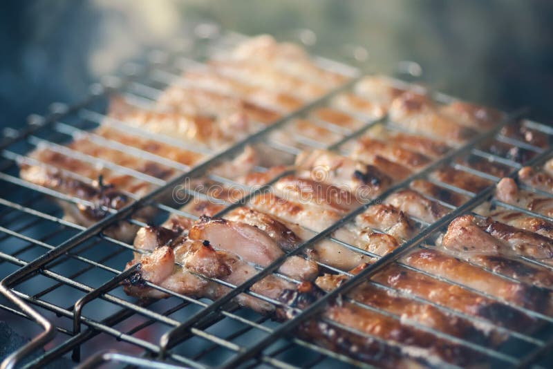 Frying meat on the grill stock image. Image of coal - 266430667