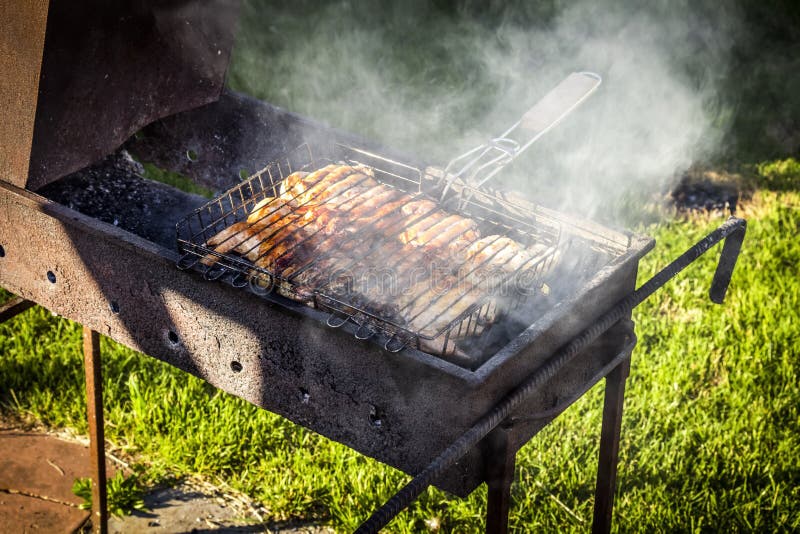 Frying meat on the grill stock photo. Image of meat - 225978364