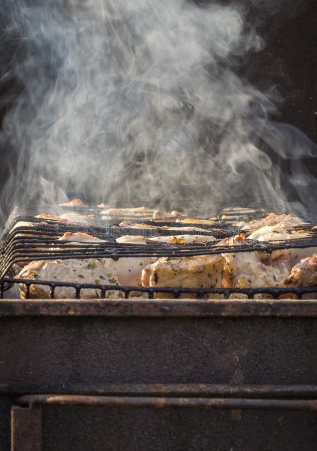Frying meat on the grill stock image. Image of cooking - 77703819