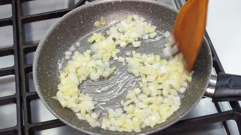POV Frying Onion in a Pan. Stirring Chopped Onion on Gas Stove. Cooking ...