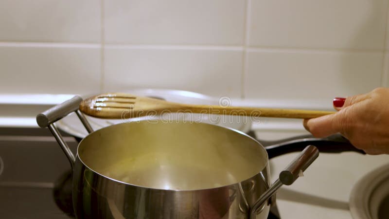 Frying onion in a pot stock video. Video of condiment - 259197983