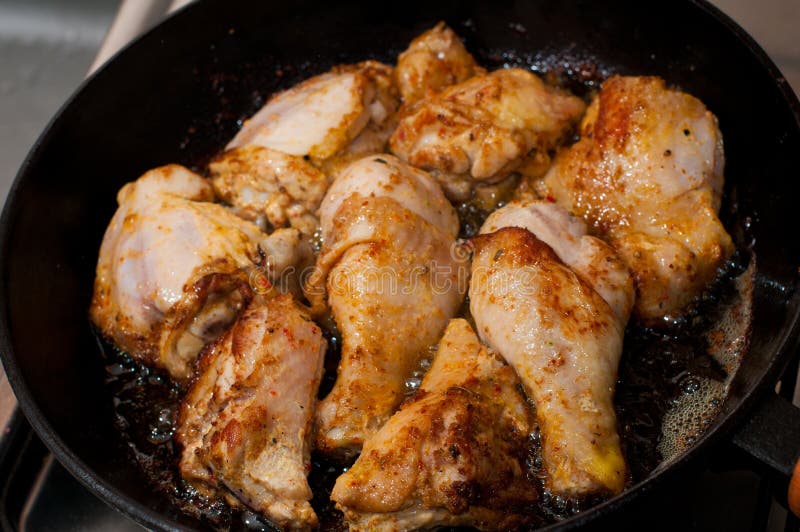 Frying Pan with Chicken Legs Inside Stock Image - Image of ruddy, mouth ...