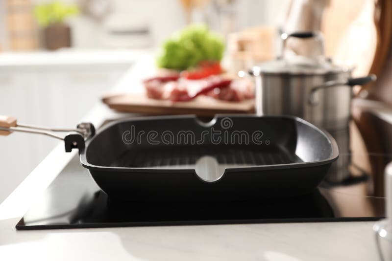 Frying Pan with Cooking Oil on Cooktop in Kitchen Stock Image - Image ...