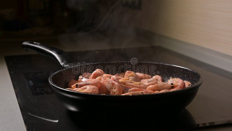 Frying Pan with Cooking Prawns with Hot Steam Raising Stock Footage ...