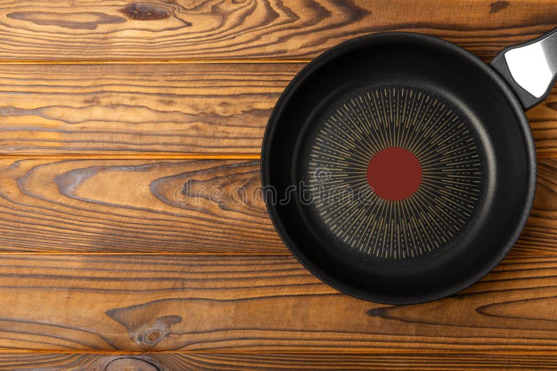 Empty Non-stick Frying Pan and Kitchen Utensils Set on Textured ...