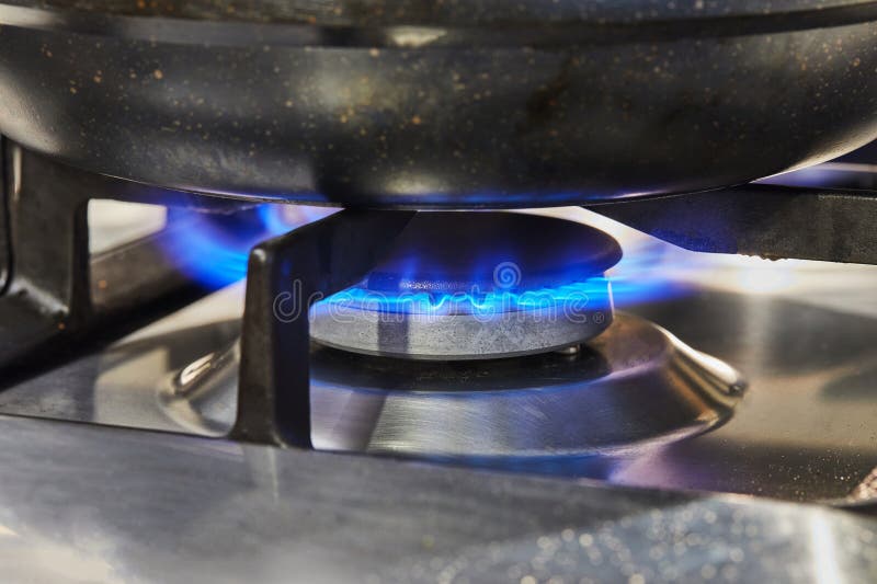 Frying Pan is on the Fire of Burner on Gas Stove Stock Image - Image of ...