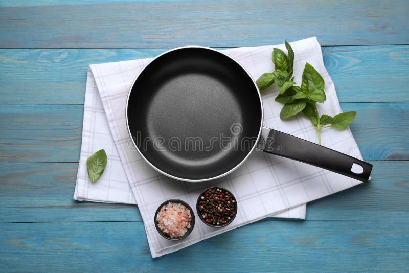 Frying Pan, Fresh Basil and Spices on Light Blue Wooden Table, Top View ...