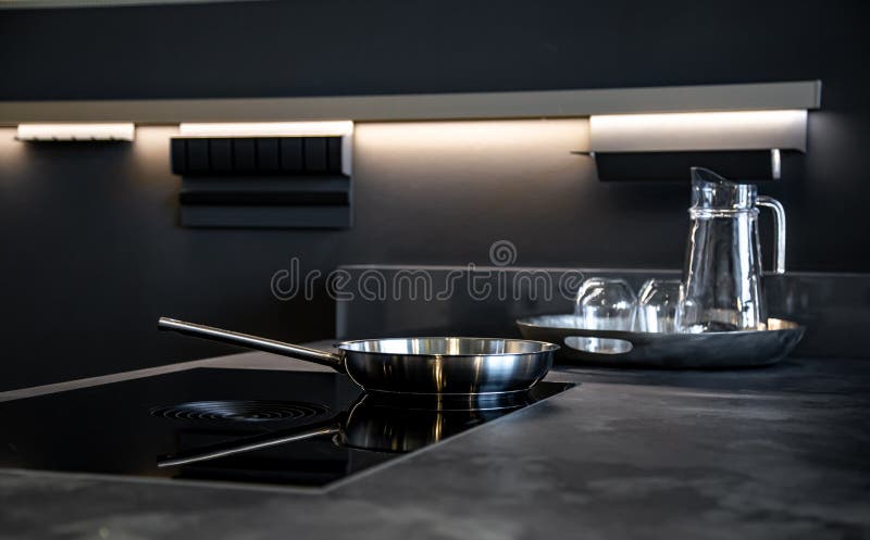 Frying Pan in the Interior of the Kitchen in Black, Modern Style. Stock ...