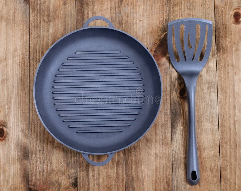 Frying Pan and Kitchen Utensils on Wooden Table Background. View Stock ...