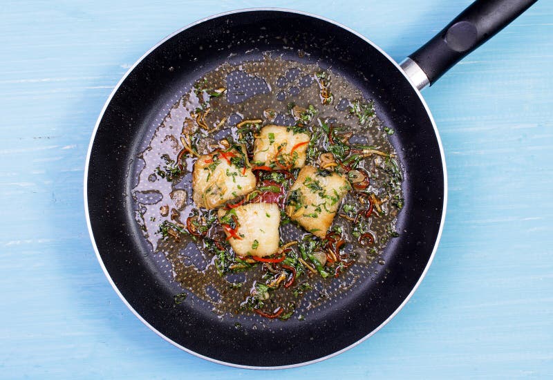 Frying Pan with the Leftovers of a Fried Fish Stock Image - Image of ...