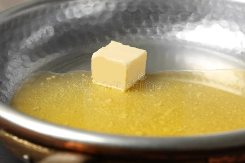 Frying Pan with Piece of Melting Butter Stock Photo - Image of milk ...