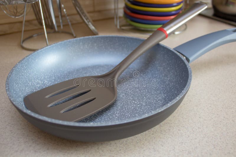 Frying Pan with Spatula,a Frying Pan Gray with a Spatula but with ...
