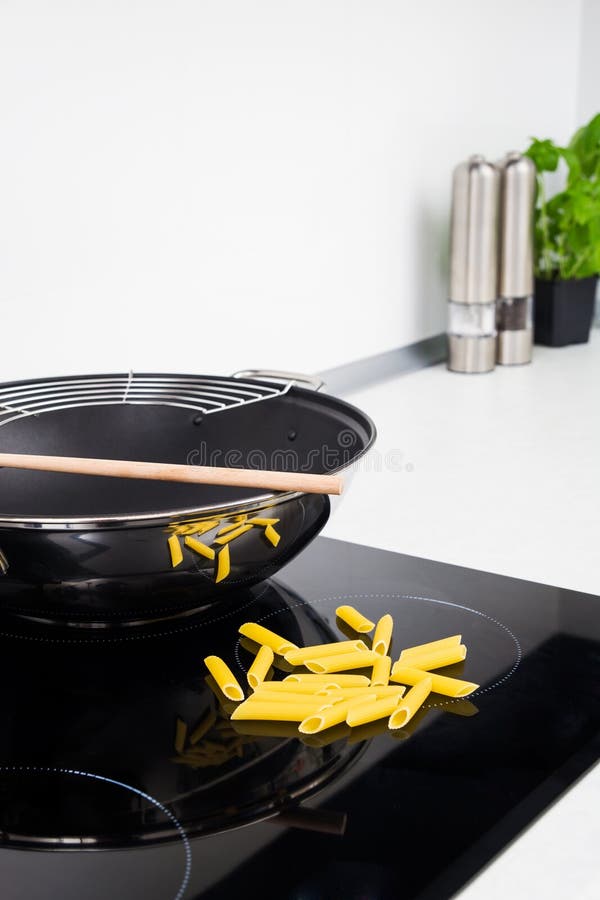 Frying Pan, Sticks and Pasta in Modern Kitchen Stock Image - Image of ...