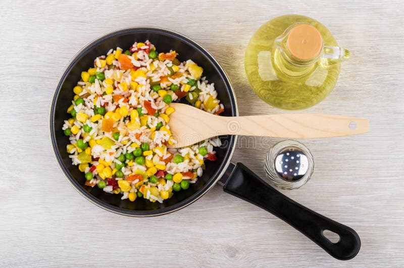 Frying Pan with Vegetable Mix, Oil and Salt on Table Stock Photo ...