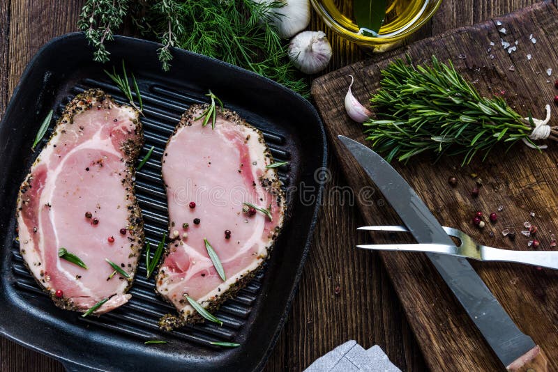 Frying Pork Lion Steaks on Pan, with Herbs Stock Photo - Image of ...