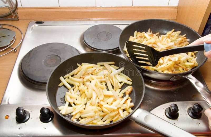 Frying Potatoes on Two Pans Stock Image - Image of food, heat: 2850577