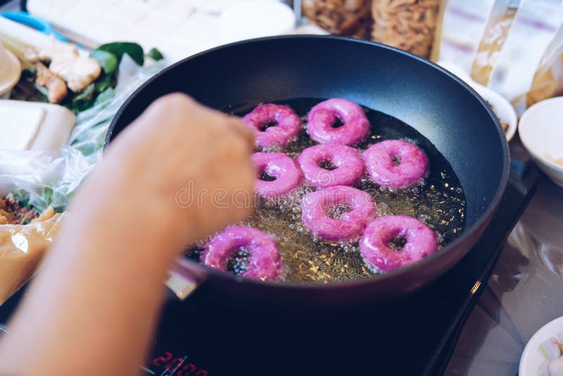 Frying Purple Sweet Potato Doughnut. Deep Fried Dessert Stock Photo ...