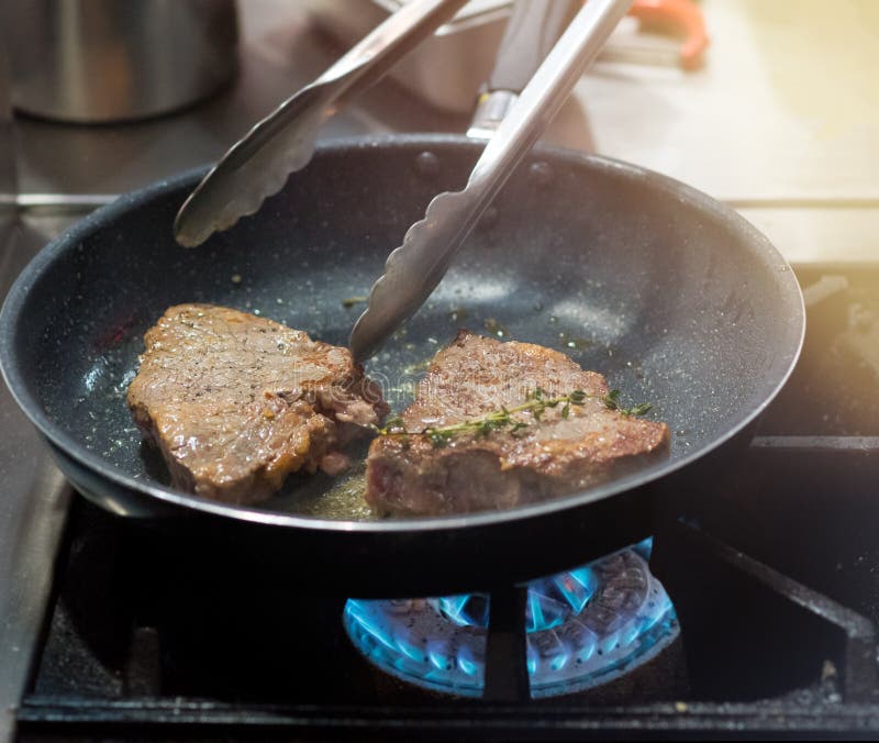 Frying a steak stock photo. Image of fried, prepare, tool - 12669970