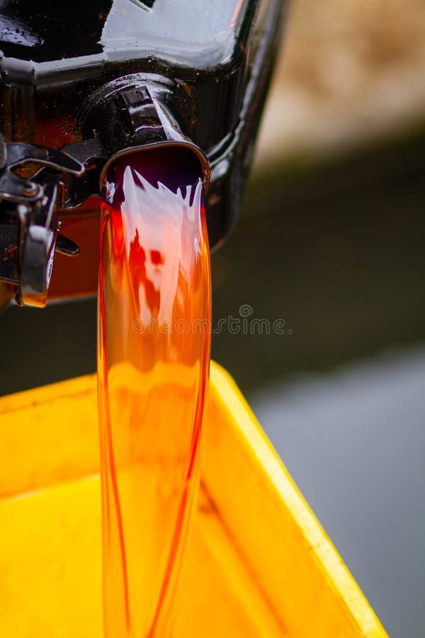 Fuel being poured stock photo. Image of container, pour - 204483438