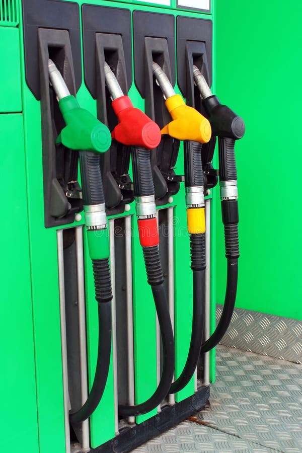 Fuel Nozzles at Gas Station Stock Photo - Image of green, benzine: 89813204