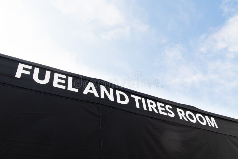 Fuel and Tires Area in Motor Sport Paddock Low Angle View of Banner ...