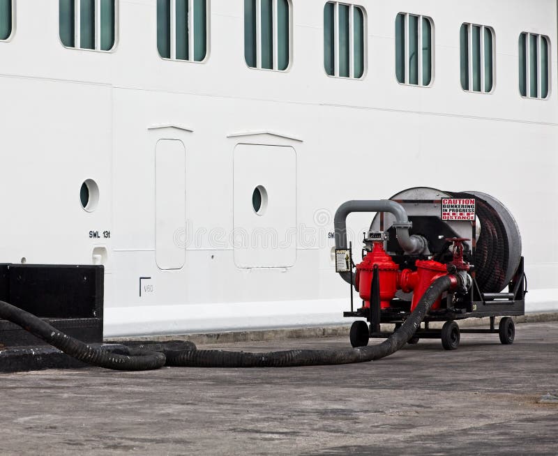 Fueling up boat stock image. Image of hand, water, boat - 6046797