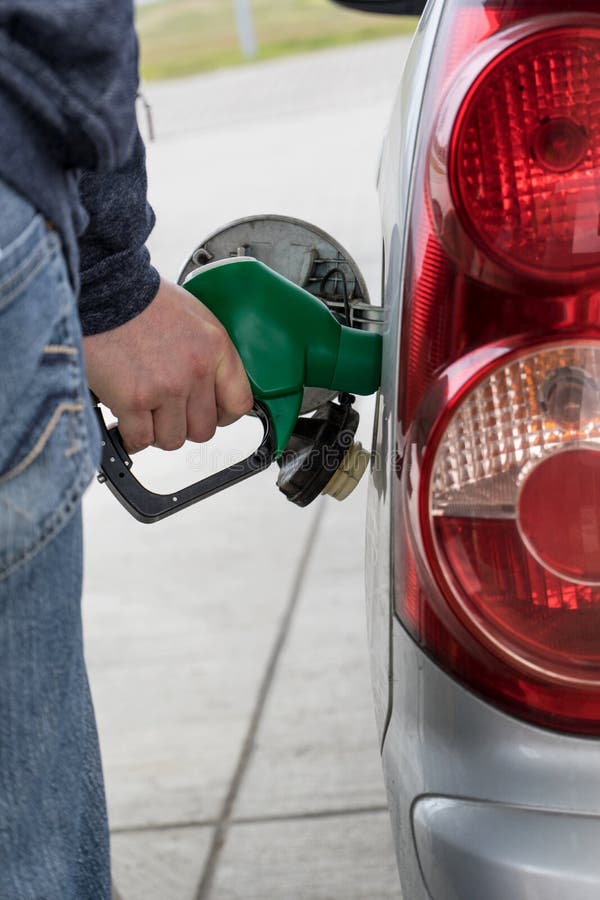 Fueling stock image. Image of hand, road, refuel, gasoline - 69792029