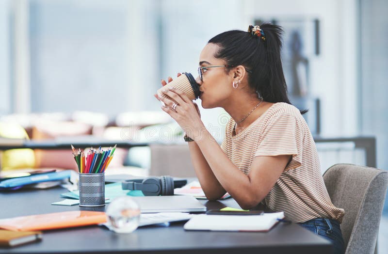 Fuelling Up for Another Successful Day. a Young Designer Drinking ...