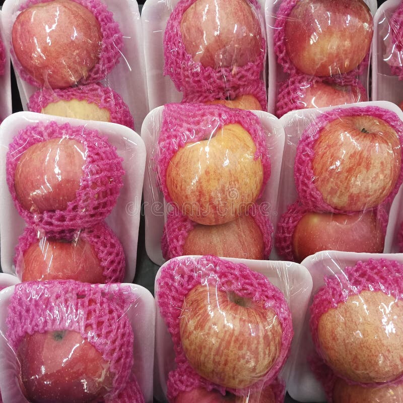 Fuji Apples Wrapped in Plastic and Styrofoam at the Fruit Market Stock ...