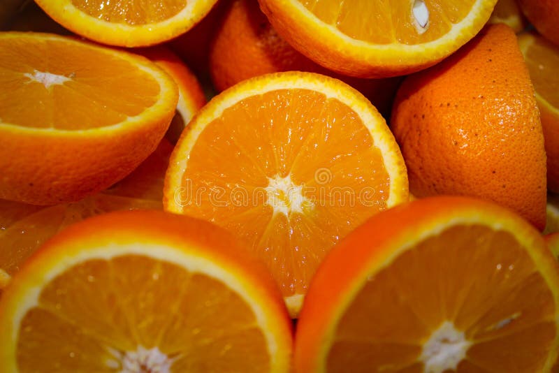 Full Background Frame of Halves of Ripe Oranges Lying Randomly on Top ...