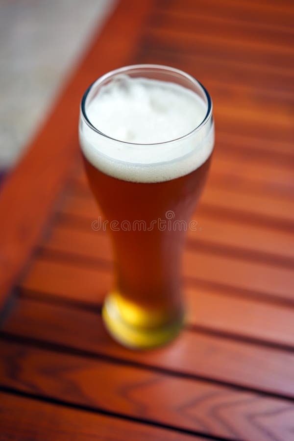 Full beer glass on a table stock image. Image of cool - 248993131