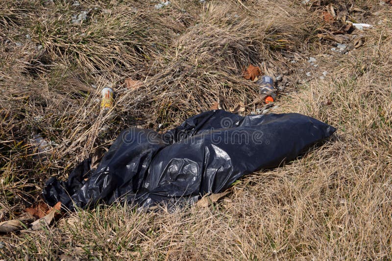 Full Black Trash Bag Dumped in a Field Editorial Photo - Image of waste ...