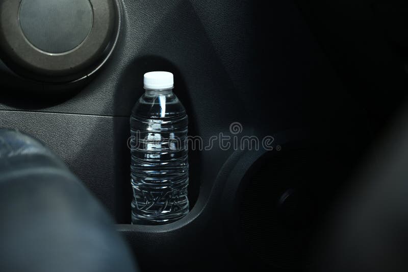 Full Bottle of Water in the Car Stock Photo - Image of drive, hand ...