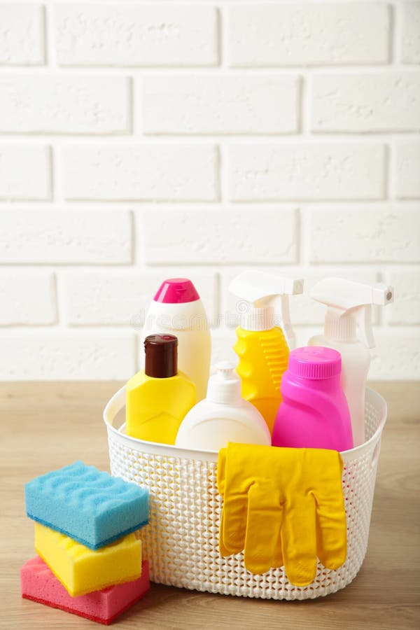 Full Box of Cleaning Supplies and Gloves on White Wall Stock Photo ...
