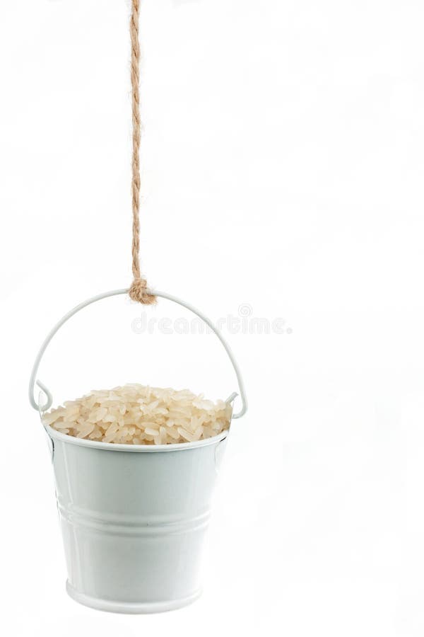 A Full Bucket of Rice Grains Hanging from a Rope Stock Image - Image of ...