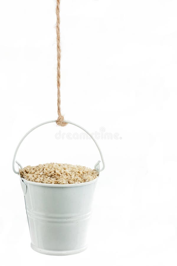 A Full Bucket of Sesame Grains Hanging from a Rope Stock Image - Image ...