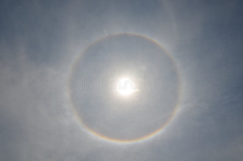 Full Circle Rainbow Around Sun at Noon, Rays Catch the Thin Vapour ...