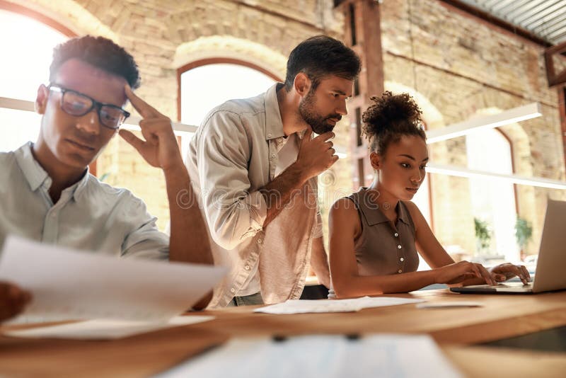 Full Concentration. Group of Young Business People Working Together ...