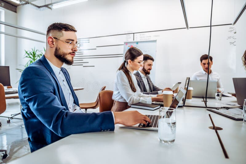 Concentration at Work. Successful Young Business People are Sitting ...