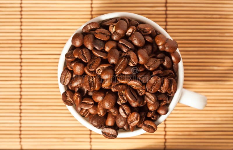 Full Cup with Coffee Beans on the Table Stock Image - Image of drink ...