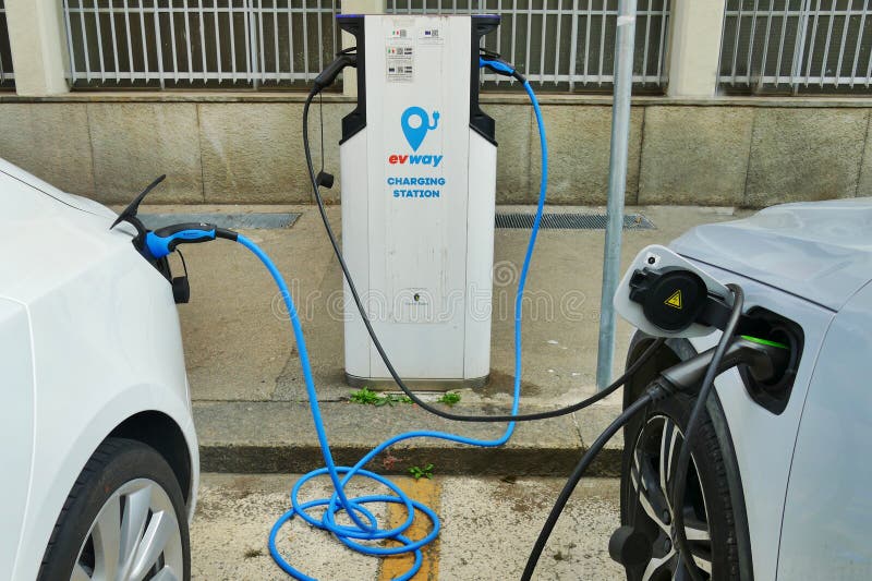 Full Electric Car Parked at Recharging Station Editorial Image - Image ...