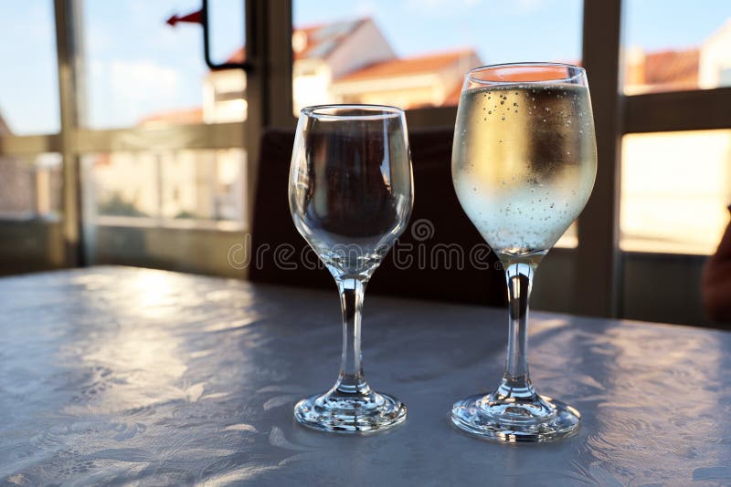 Full and Empty Glass Stand on the Table Stock Image - Image of fresh ...